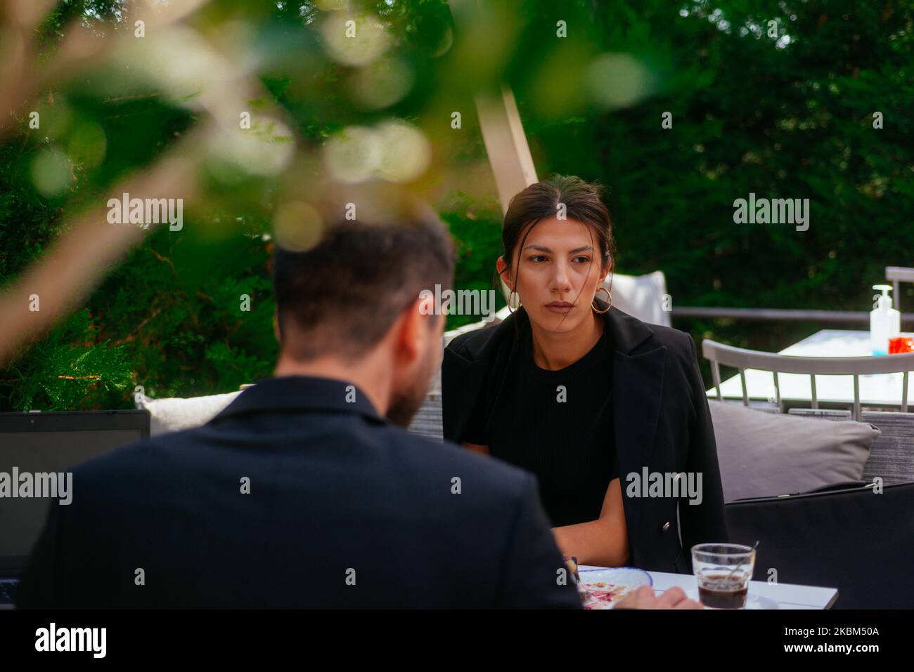 A stunning businesswoman is confused. She is thinking how to solve the ...