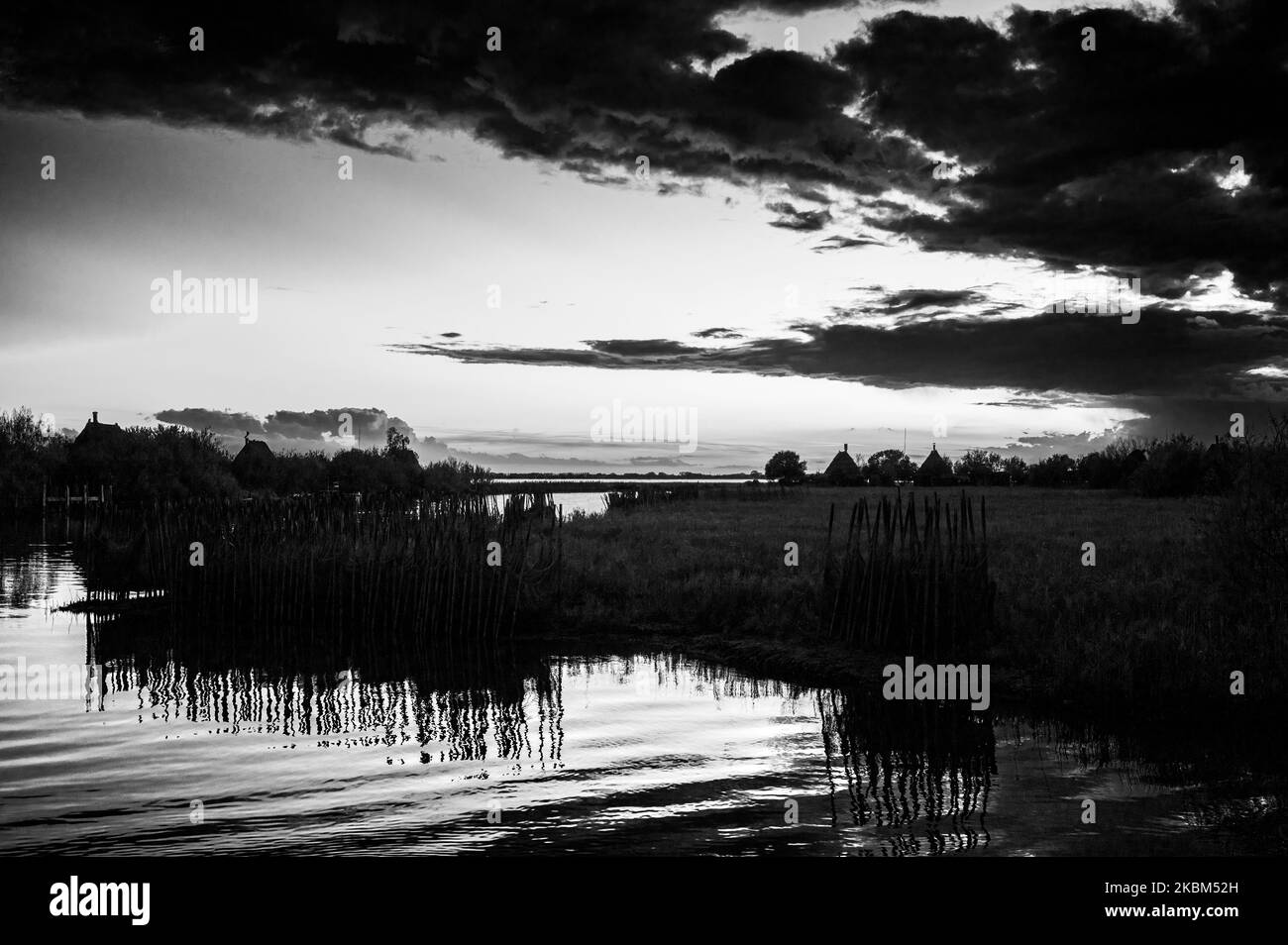 Towards the sunset. Marano lagoon late summer colors. Clouds and sun ...