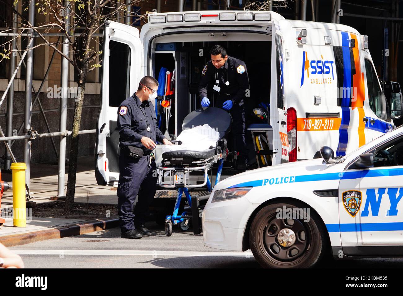 EMS workers is seen attending to a patient outside mount Sinai ...