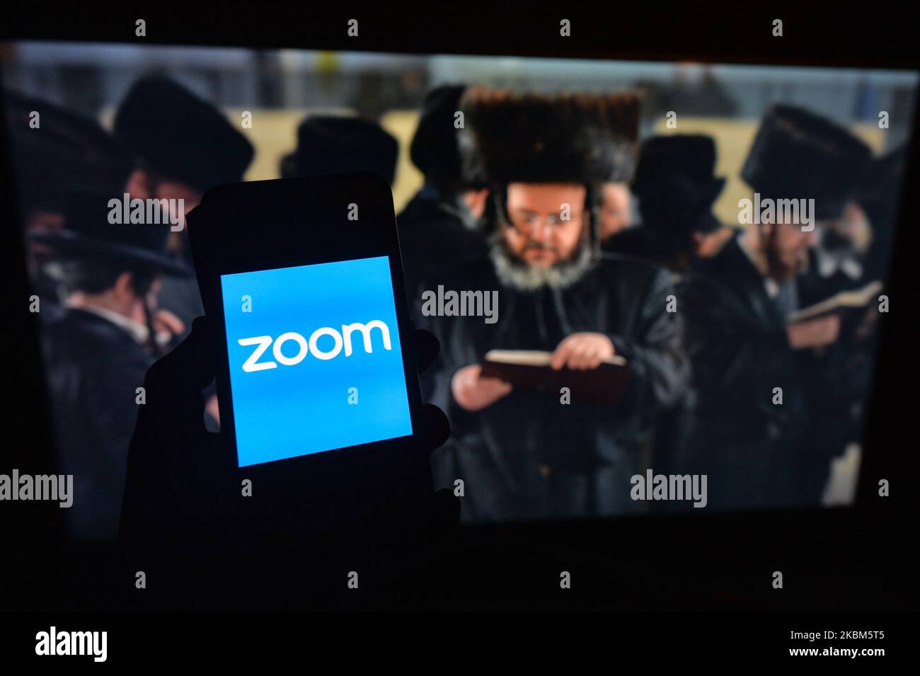 Zoom app displayed on a mobile phone. Passover, also known as 'Pesach ...