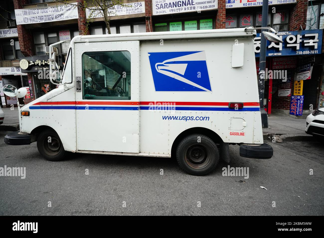A view of United States postal service delivery van in borough of ...