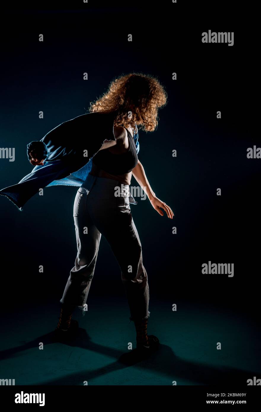 Slender flexible dance performer during a dance practice in modern ...