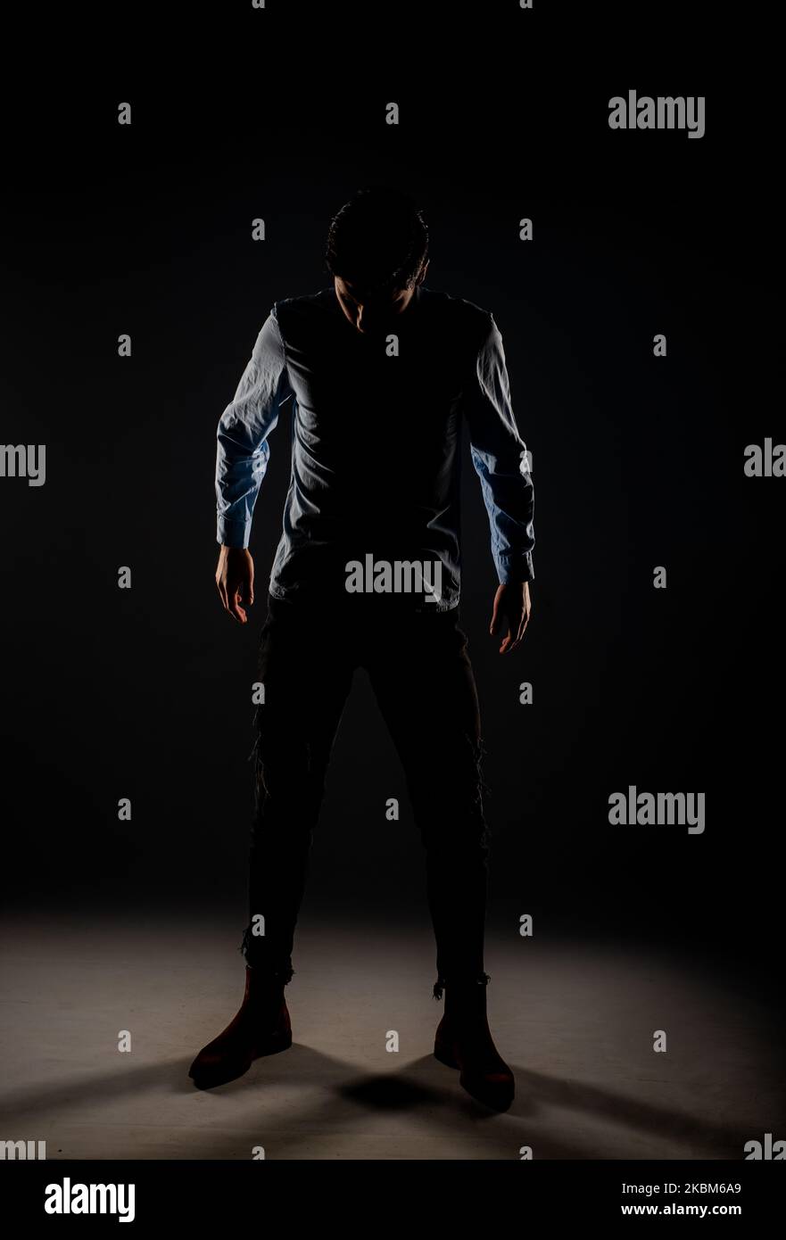 Dimmed light man hi-res stock photography and images - Alamy