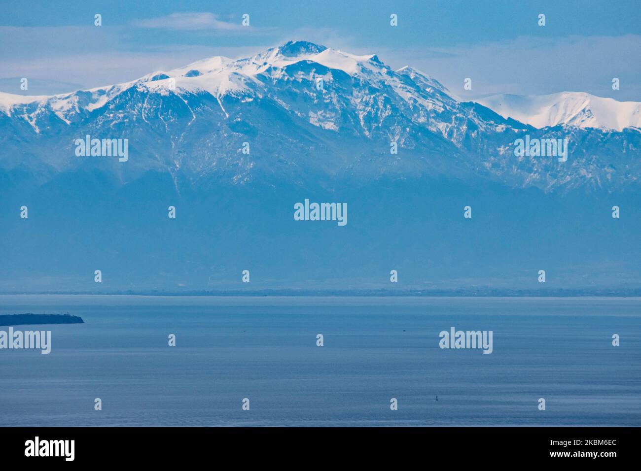 Snow-covered Mount Olympus as seen from Thessaloniki city in Greece after the rare weather and ...