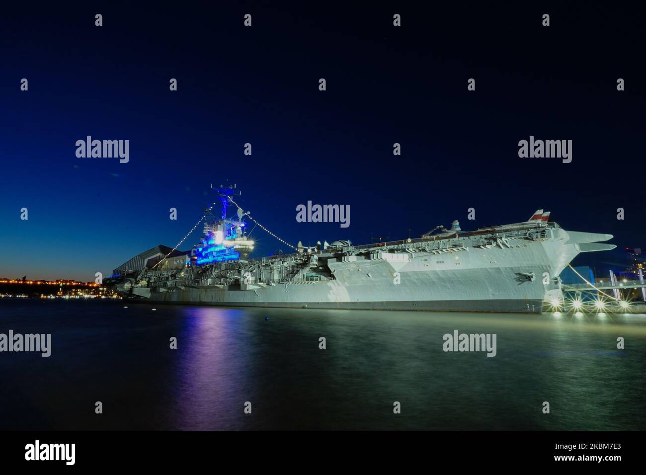 USS Intrepid is seen with blue lights on April 9, 2020 in New York City ...