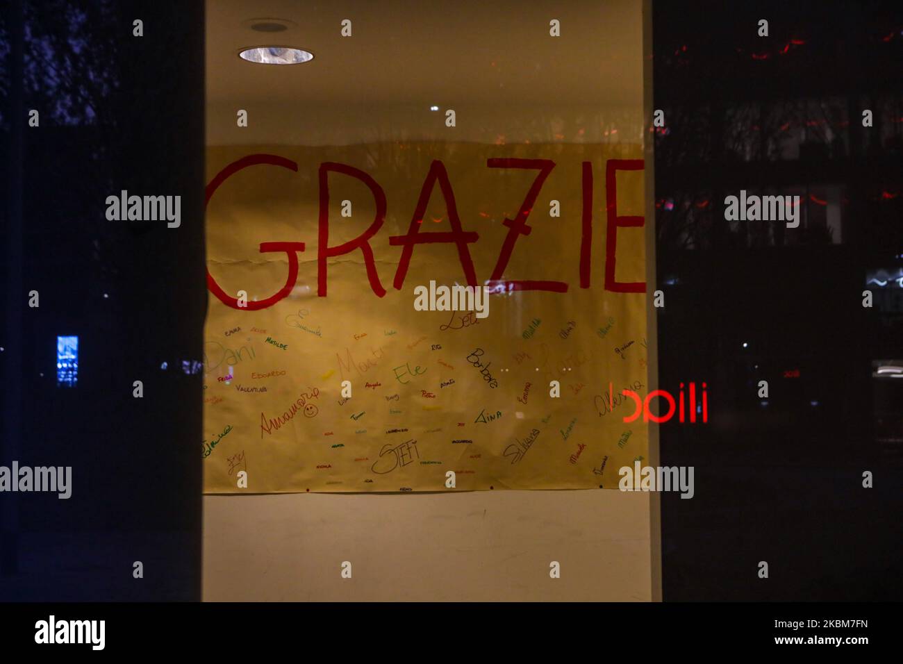 A sign saying 'Thank you' is hanging on the wall of a kindergarten ...