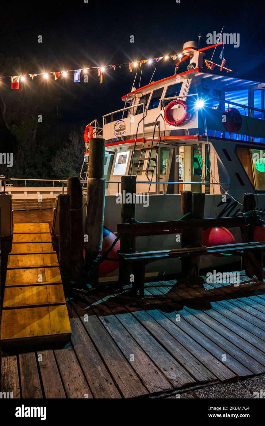 Towards the sunset. Marano lagoon late summer colors. Clouds and sun ...