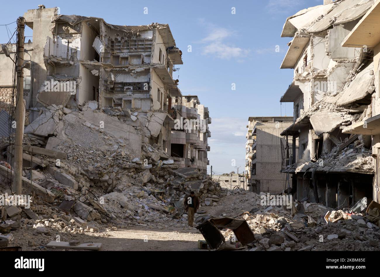 A picture taken on April 10, 2020, shows a Syrian man walks past the ...