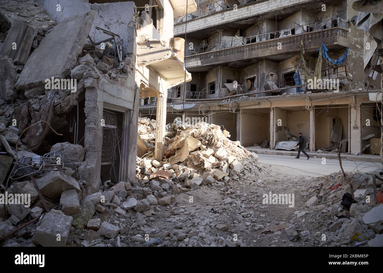 A picture taken on April 10, 2020, shows a Syrian man walks next the ...