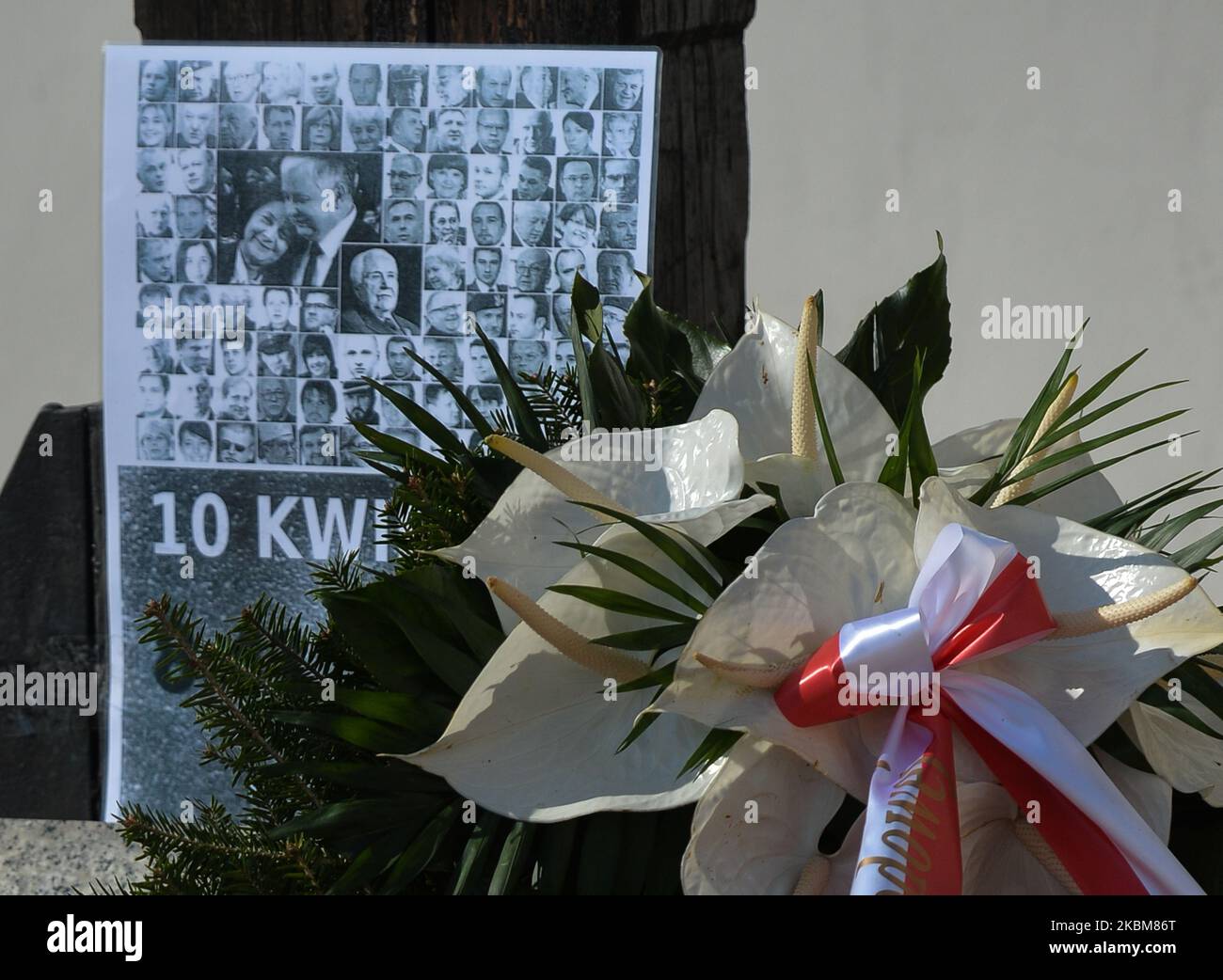 A view of a poster showing photos of all passengers killed in the crash ...
