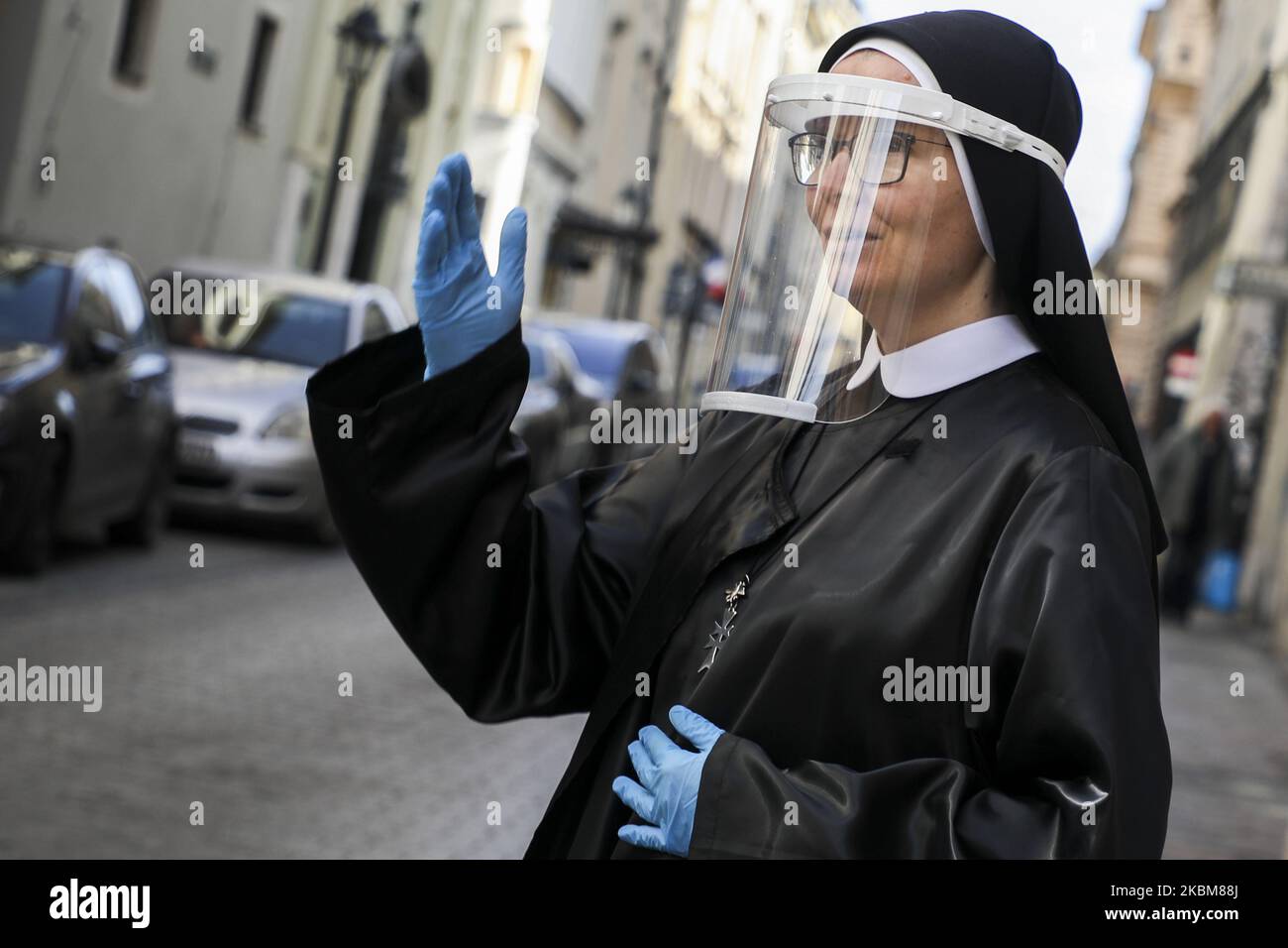 A Nun Wearing A Protective Face Shield Is Seen While Sisters Canonesses Of The Holy Spirit