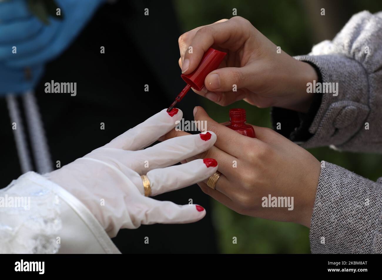 Palestinian bride Nermin gets nails painted over her gloves amid the ...