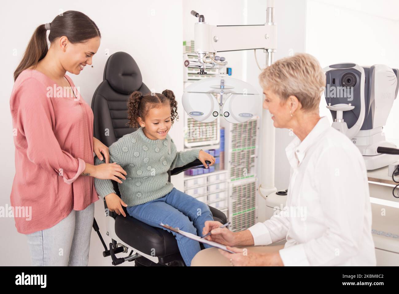 Consulting, mother and child with an eye doctor for healthy eyes ...