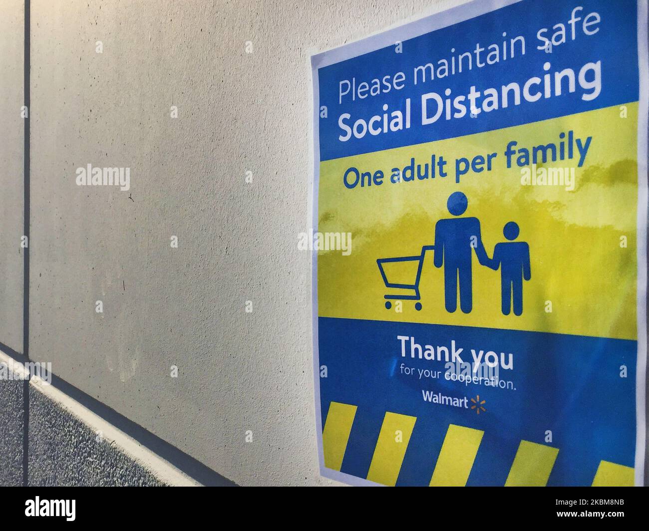 Sign promoting social distancing (physical distancing) at a Walmart ...