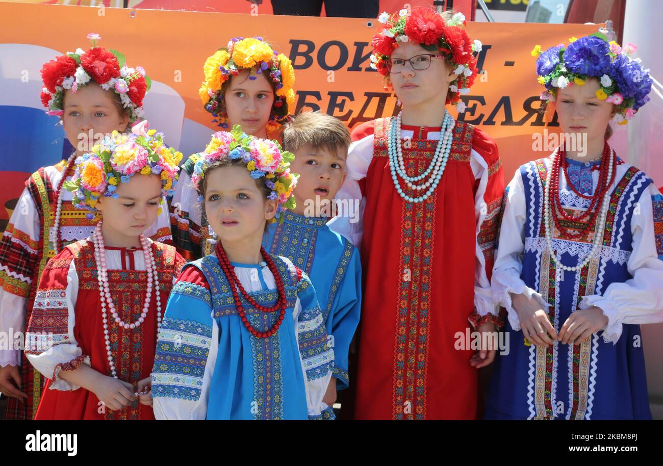 Russian children dressed iin tradtional attire celebrate the ...