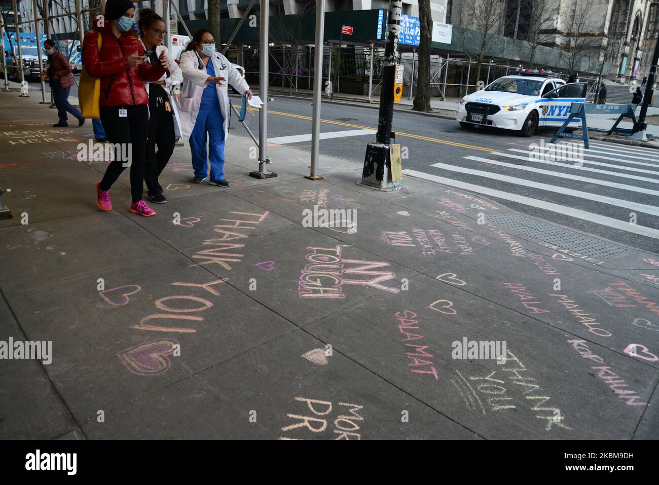 Nurses read "thank you" messages scrawled in chalk in many languages ...