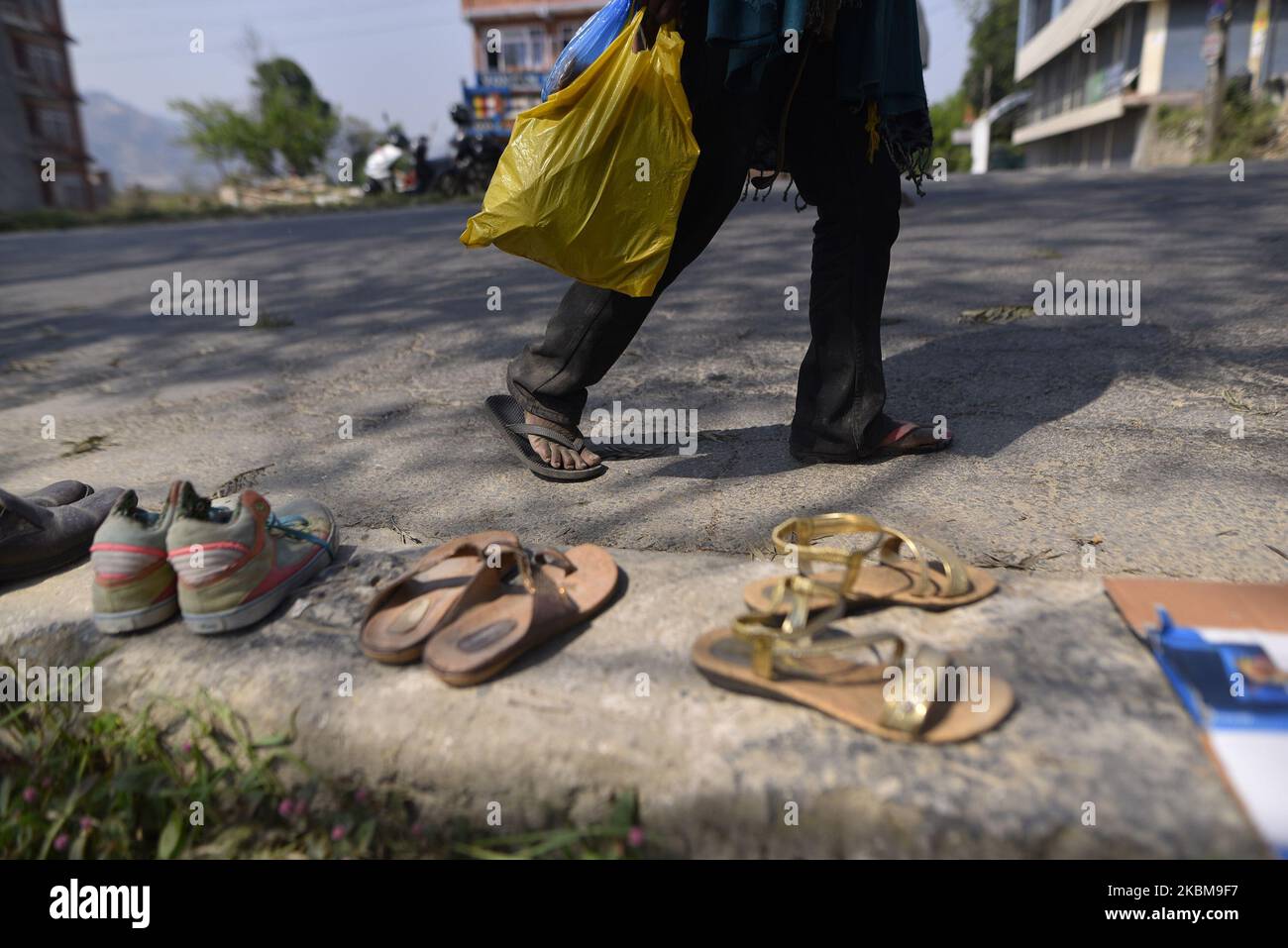 A man walks toward home in sandals at Dhulikhel, Kavrepalanchok, Nepal ...