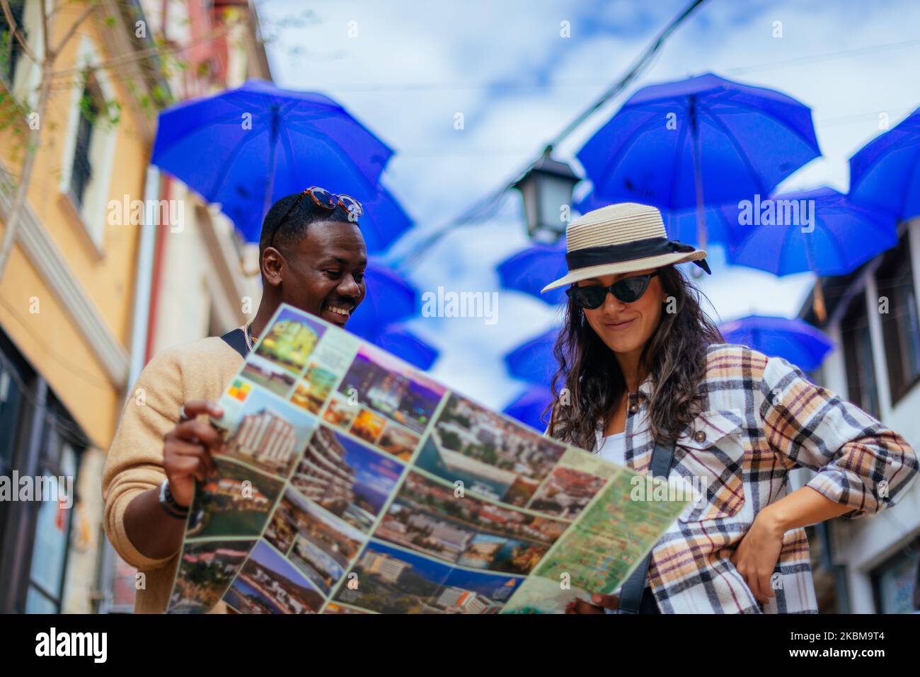 Two friends hanging out, looking for a new place on the map to visit ...