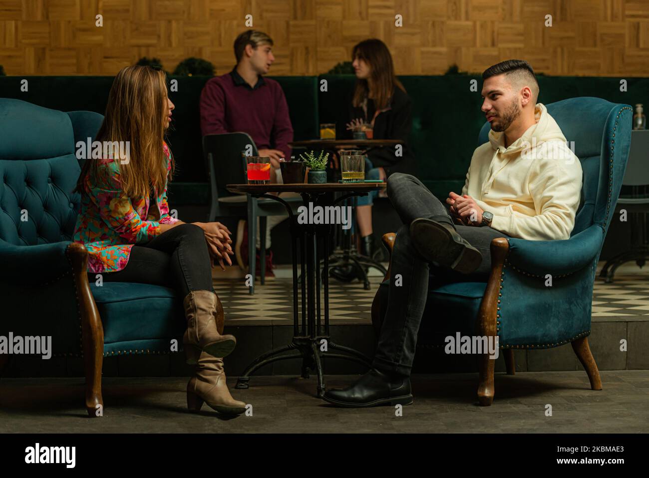 Two amazing and beautiful couples are talking to each other while ...