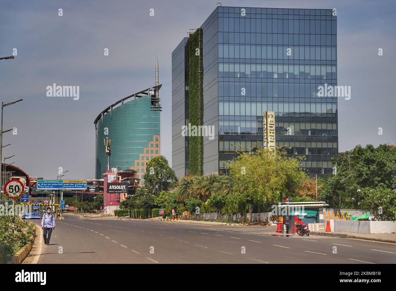 A man walks past DLF Corporate office buildings amid India lock down ...