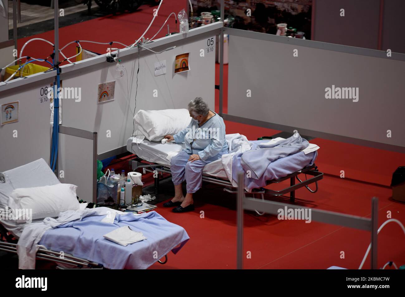 Patients rest in their beds at the temporary hospital for COVID-19 ...
