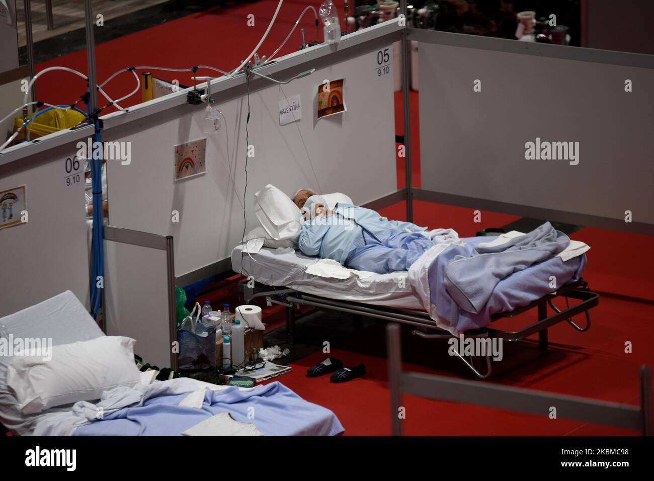 Patients rest in their beds at the temporary hospital for COVID-19 ...