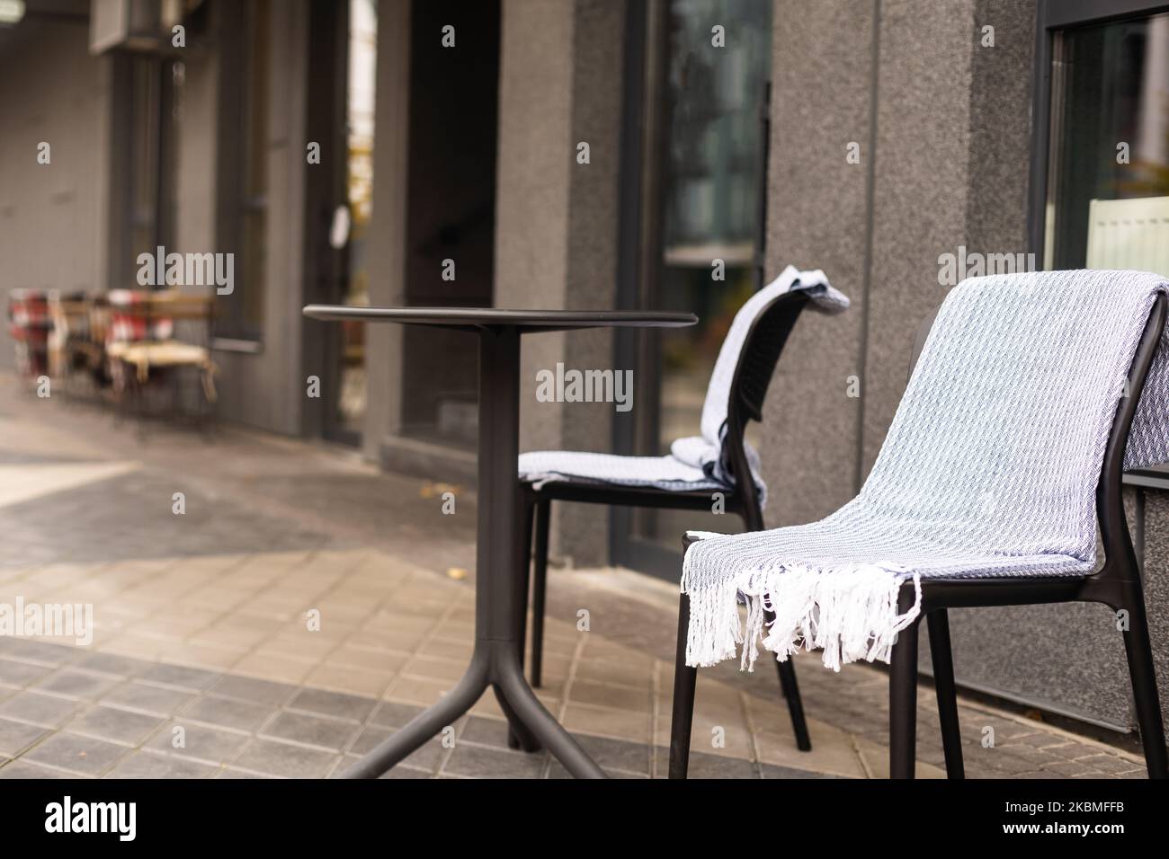 Coffee table terrace with blanket Stock Photo - Alamy