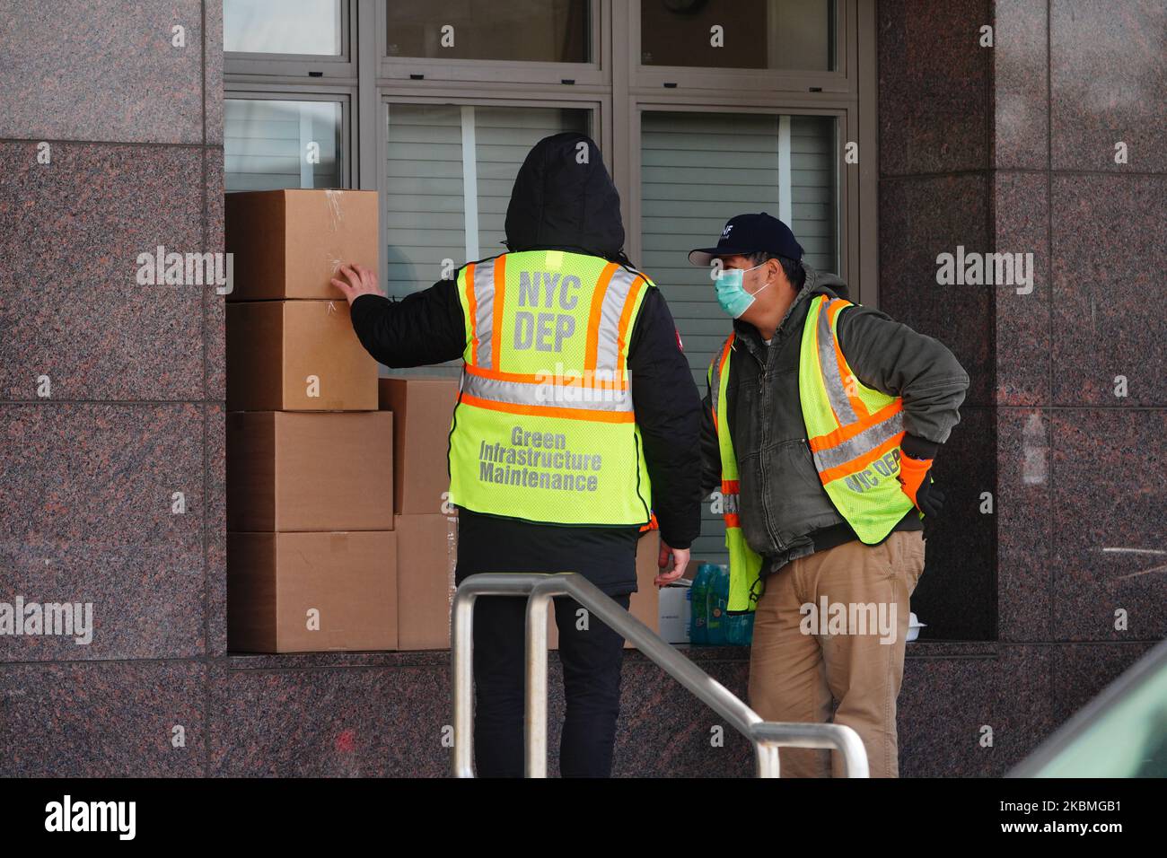 A view of New York City workers distributing relief goods at Flushing ...