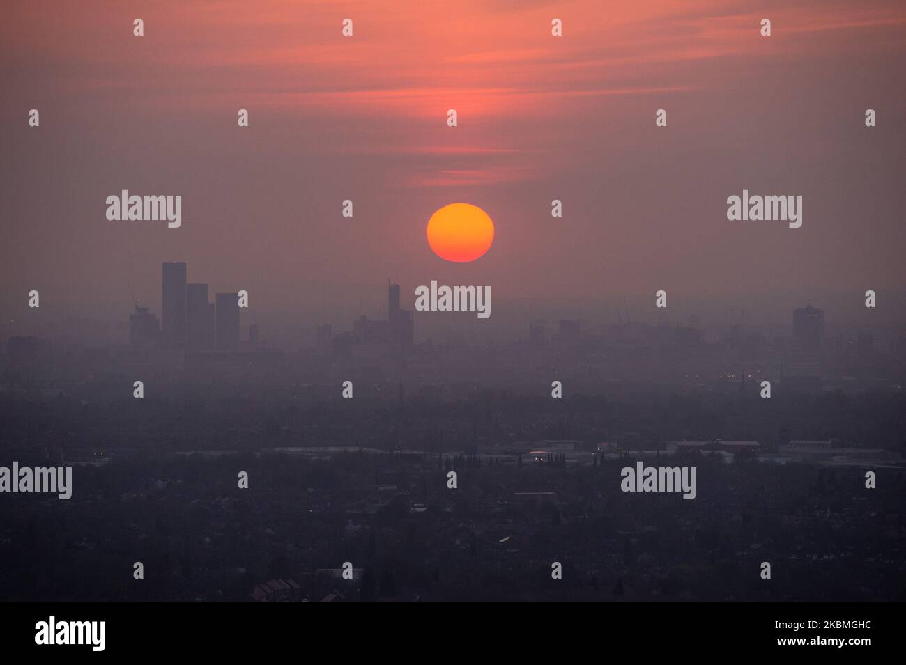 The sun setting behind Manchester's skyline, as seen from in Hyde ...