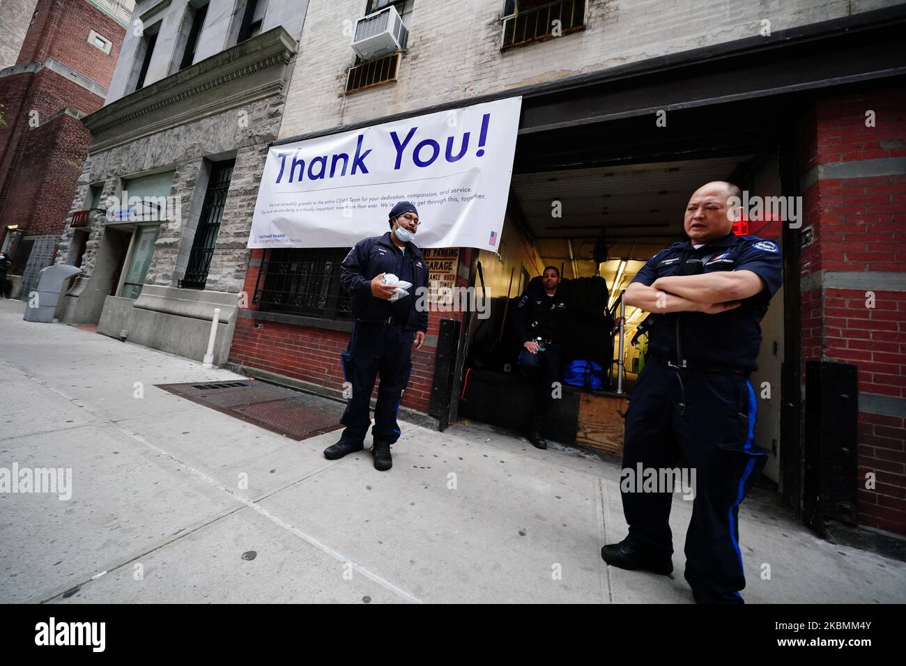 EMS workers having a break in front of a Thank You sign at Lennox ...