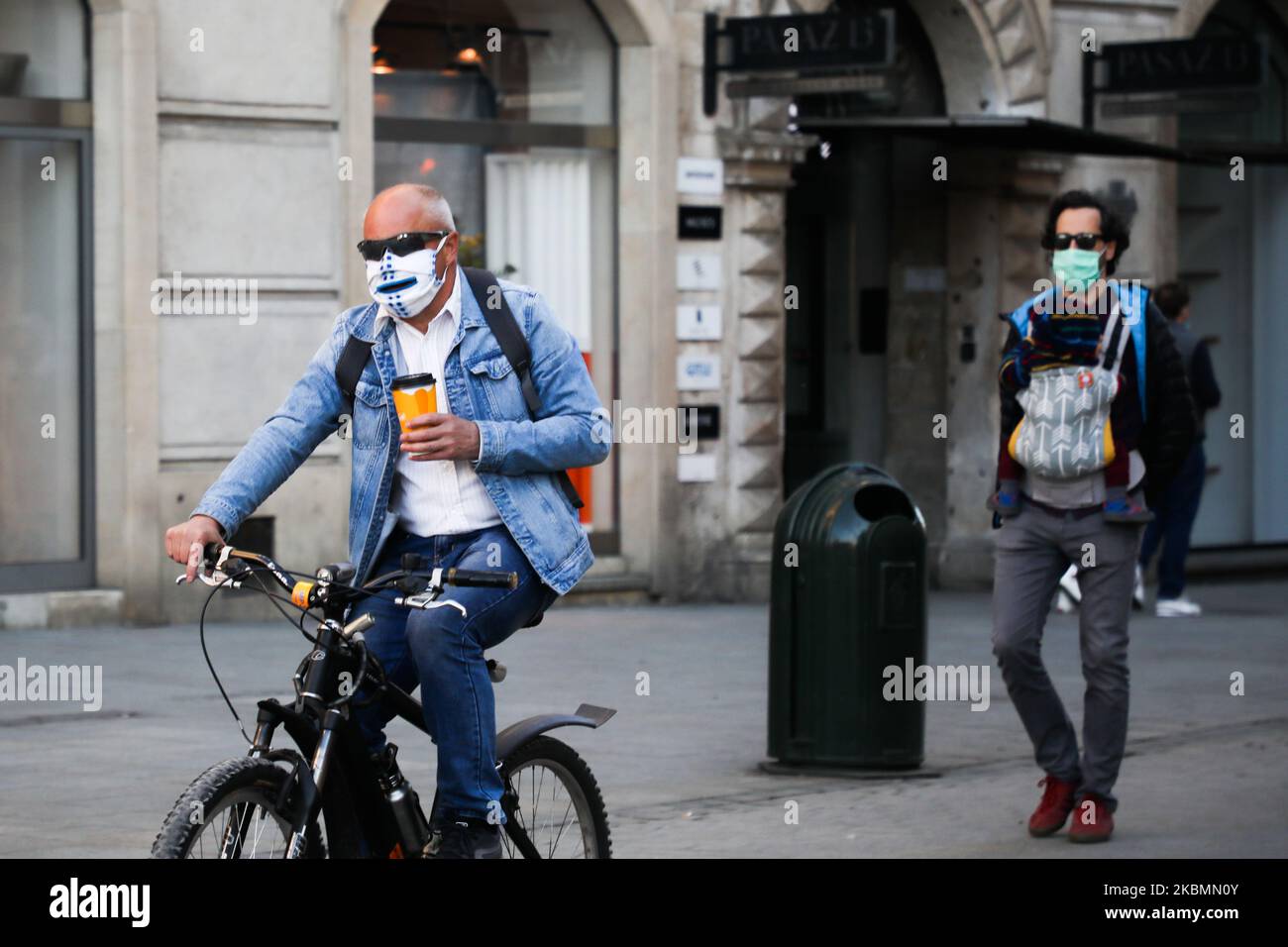 Men wear protective face masks due to the spread of coronavirus. Krakow ...