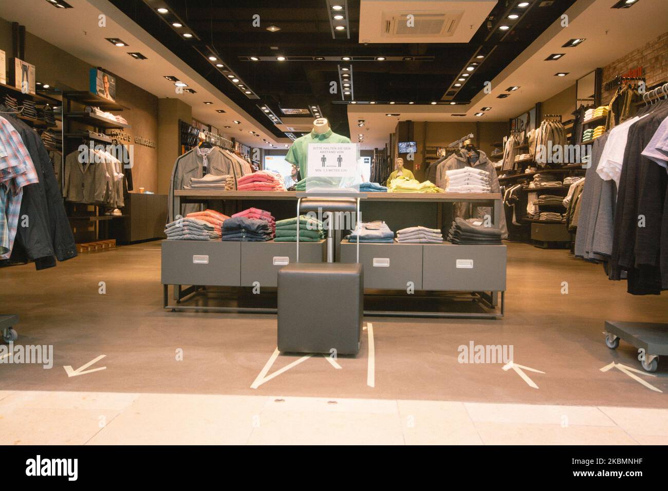 Signs of entrance and exit are seen in a store inside of Arcaden ...