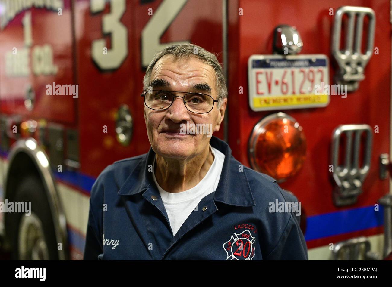 Active volunteer firefighter Manual Alves, 73, stands next to Engine 32 ...
