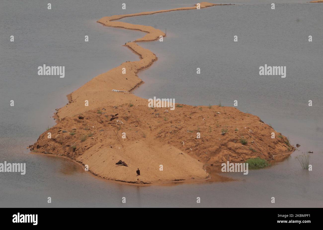 A sand pit is seen inside the Kuakhai river as is looks deserted due to ...