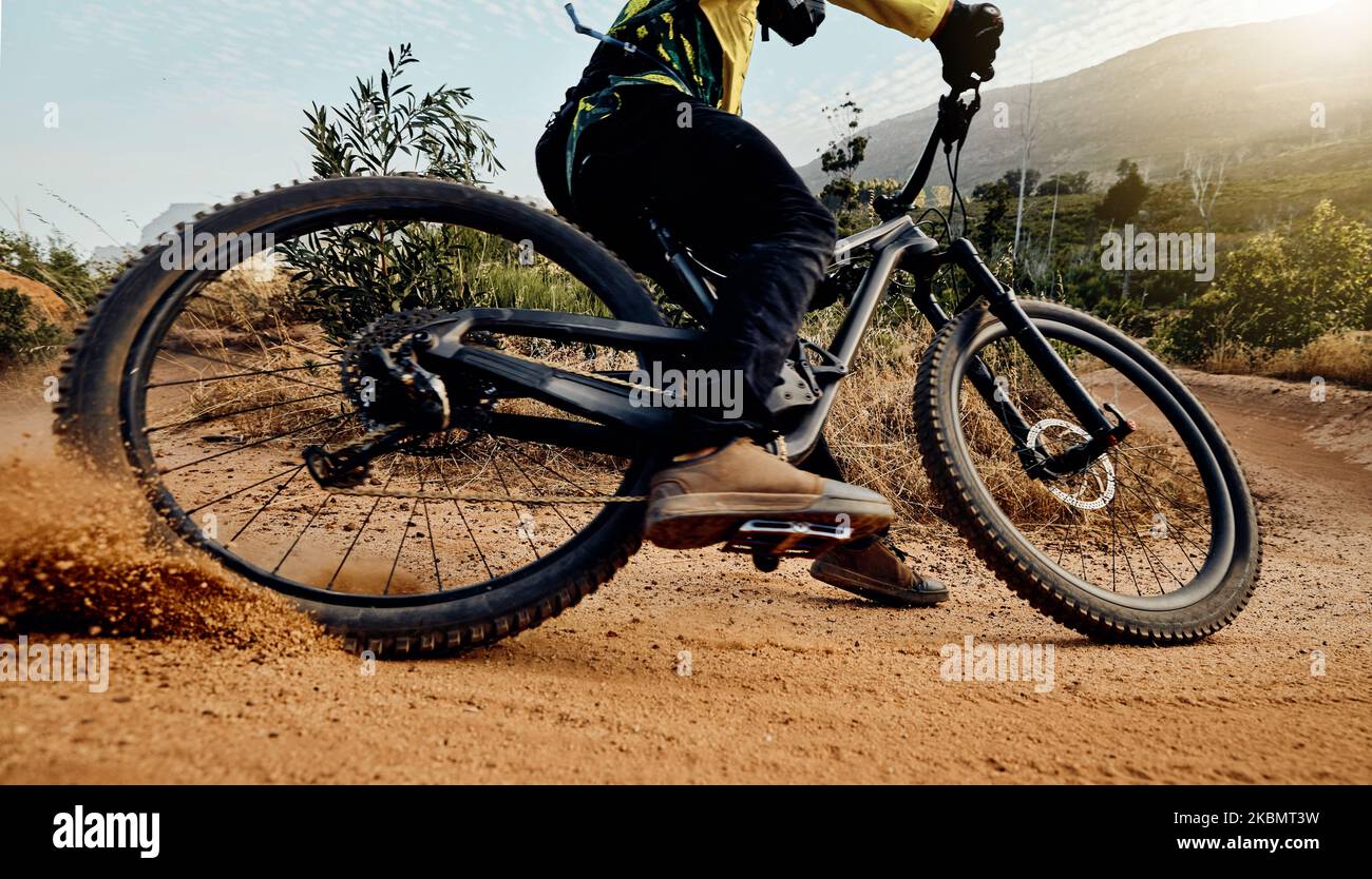 Sports, action and biker dirt racing on mountain bike enjoying riding ...