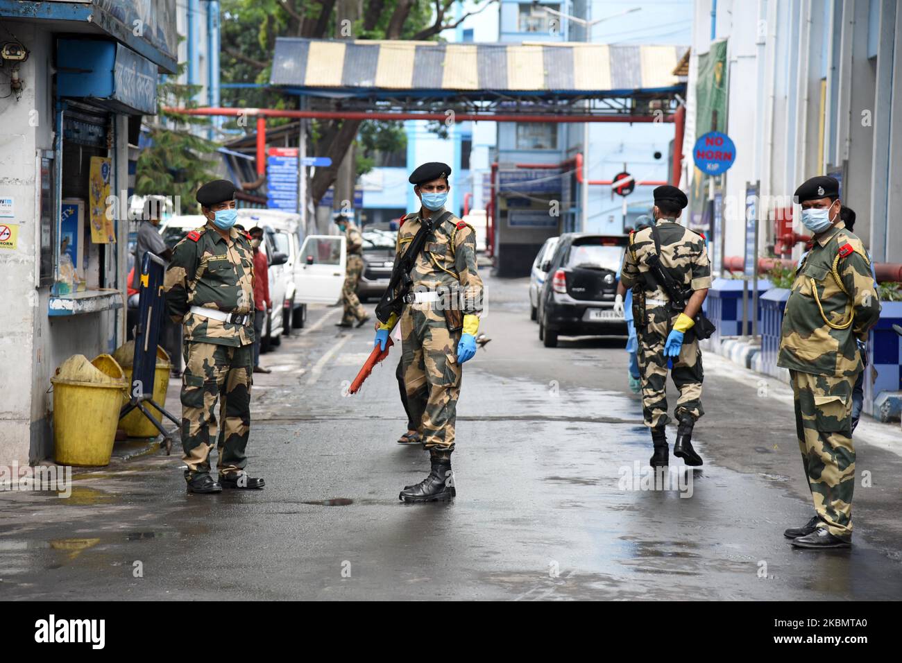 Border Security Force (BSF) personnel stand guard, wearing protective ...