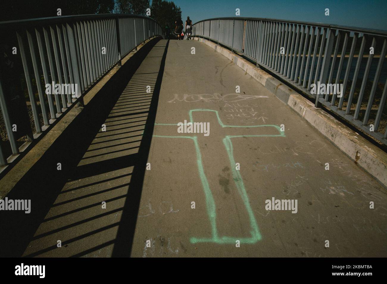 a cross chalk drawing is seen which is read "Everything will be Okay ...