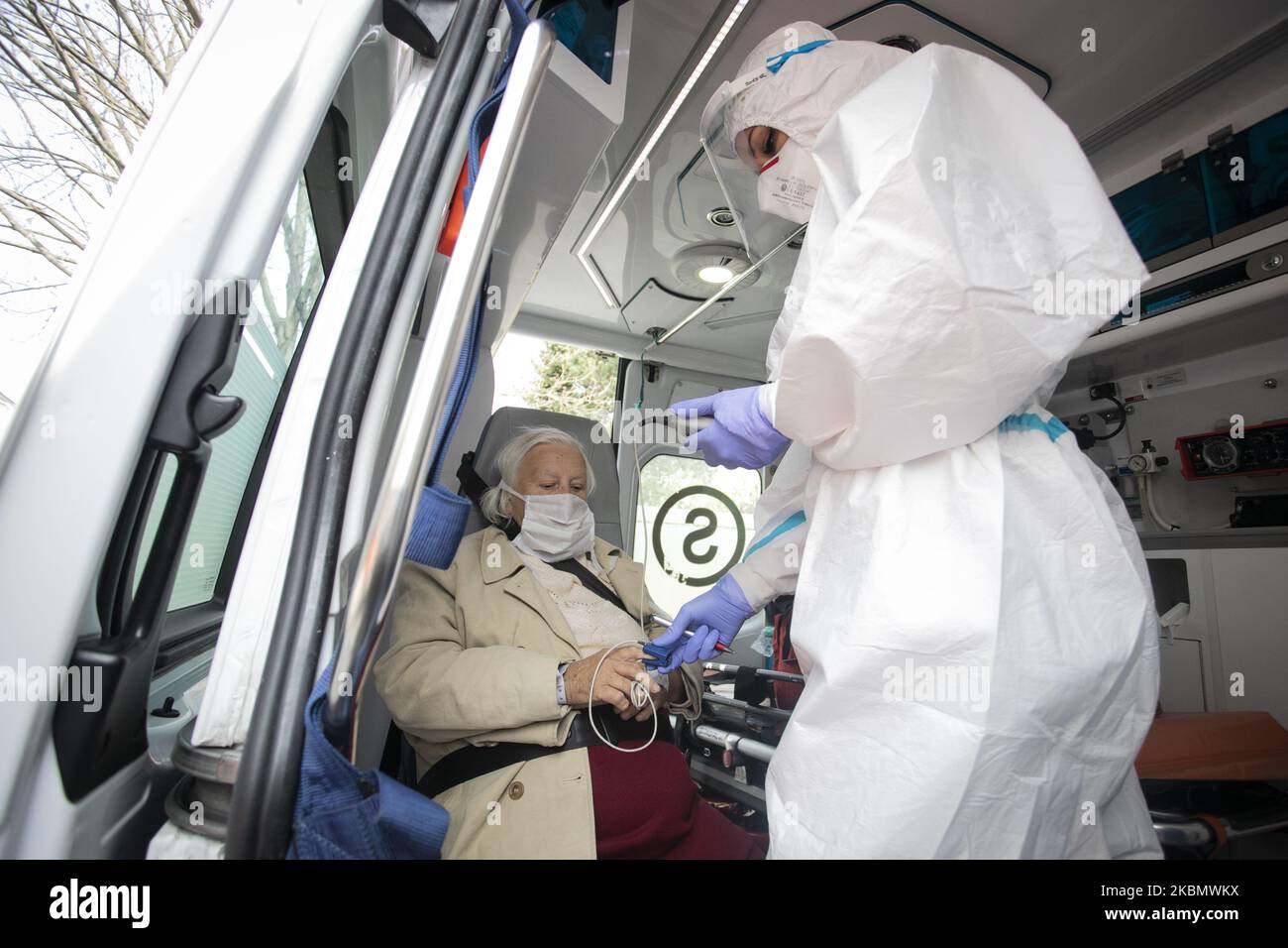 Medical worker wearing protective suit in front of a field emergency ...