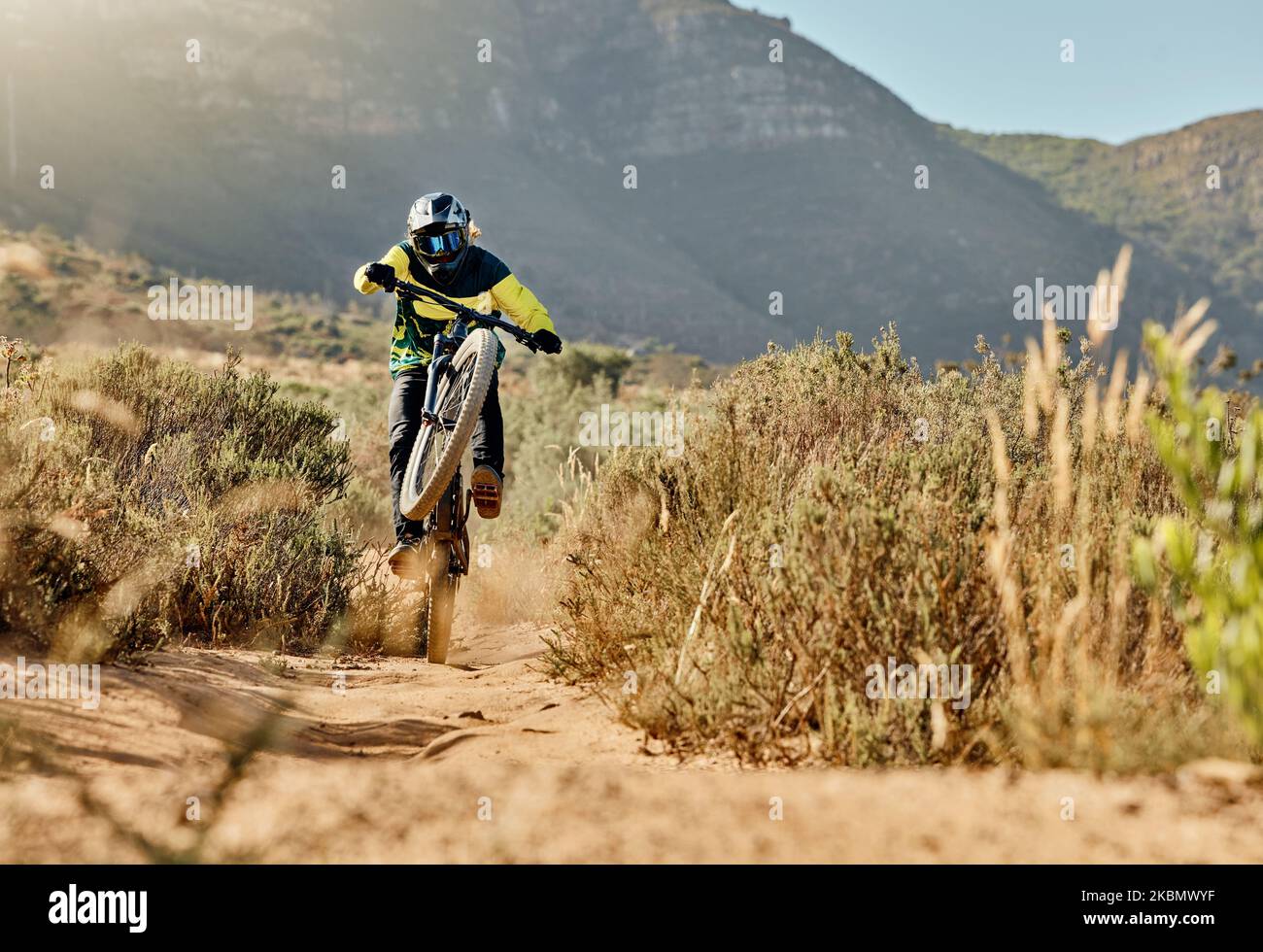 Mountain bike man, extreme sports and jump outdoor on dirt track ...