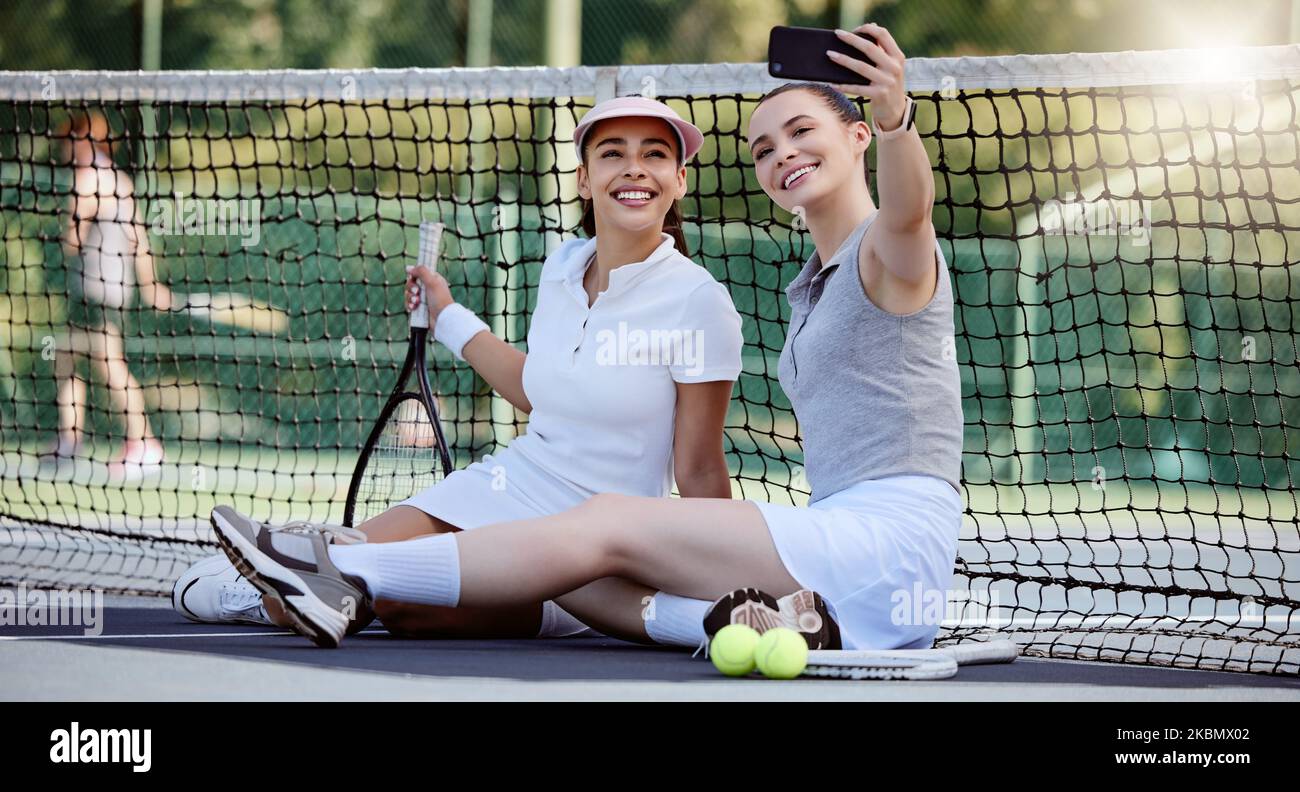 Women, tennis court or phone selfie in fitness bonding, workout break ...