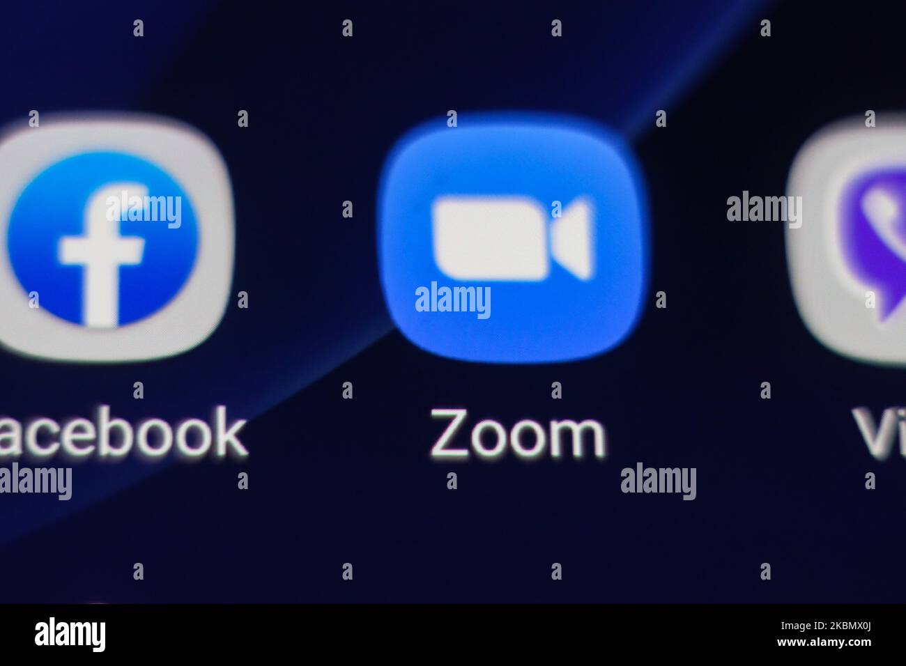 ZOOM Video Communications logo displayed on a phone screen, thumbnails ...