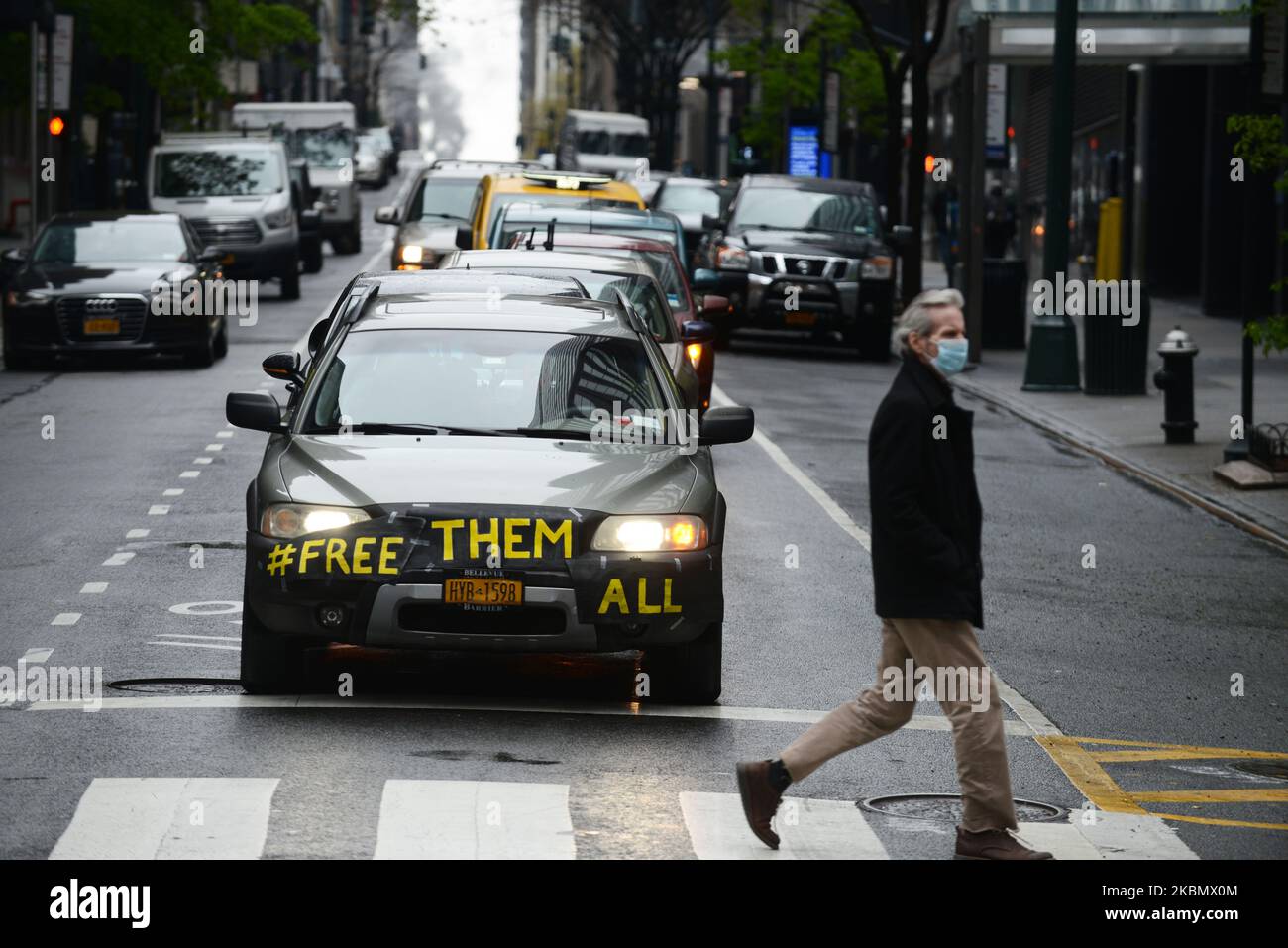 Left-wing protestors engage in a "socially distanced protest" in cars ...
