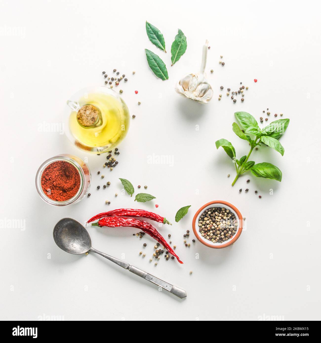Healthy cooking seasonings frame with fresh herbs, olive oil, spoon and ...