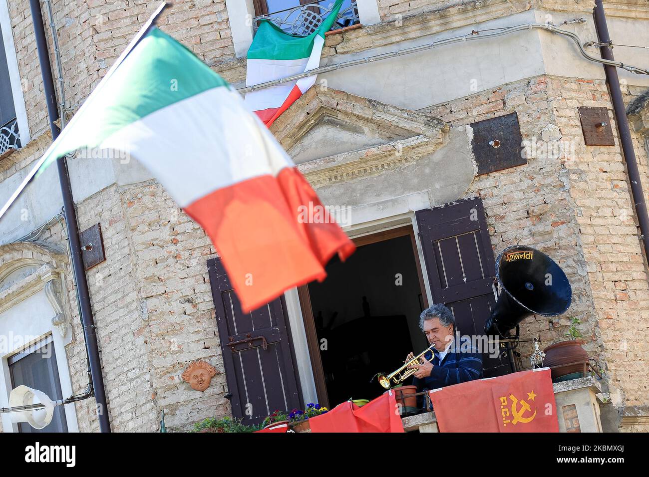 Trumpetist playing Bella Ciao on his balcony during the Italian ...