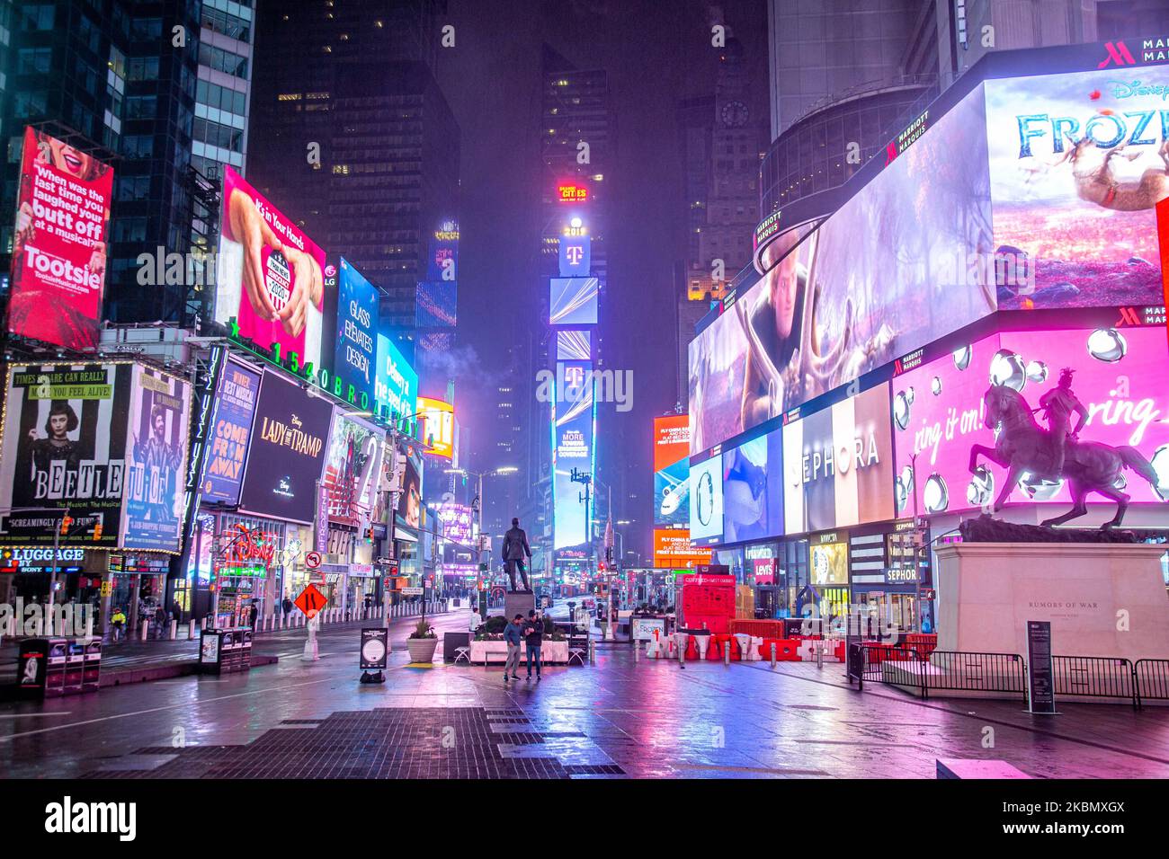 Night view of Times Square in Manhattan, New York City, USA during light rain showers in the ...
