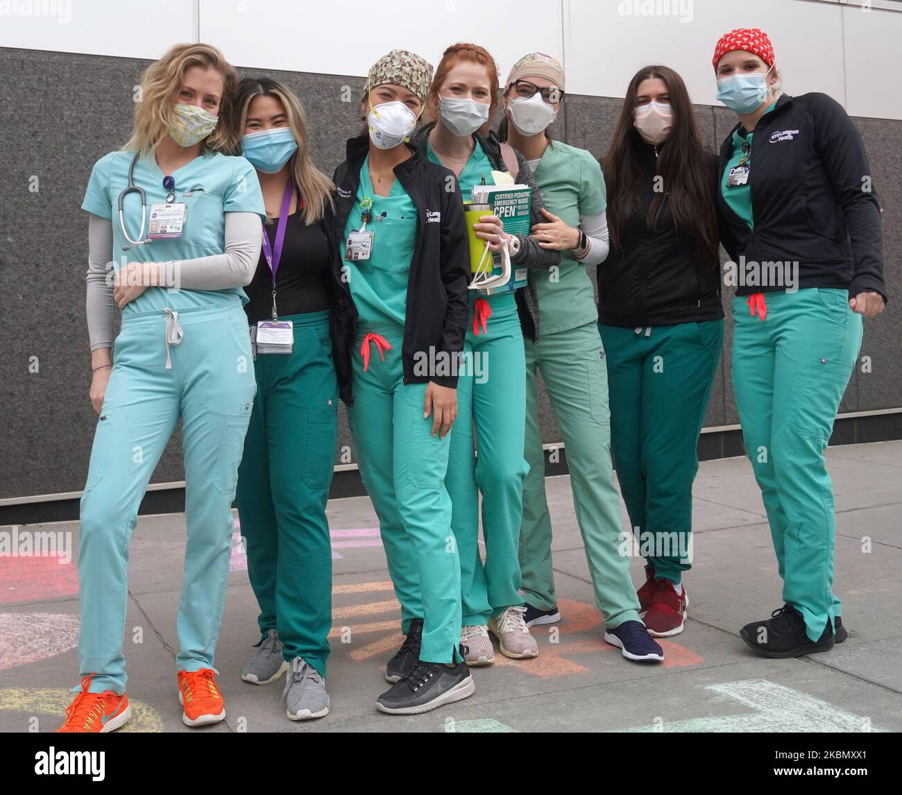 Healthcare workers at NYU Langone Health - Tisch Hospital stand outside ...