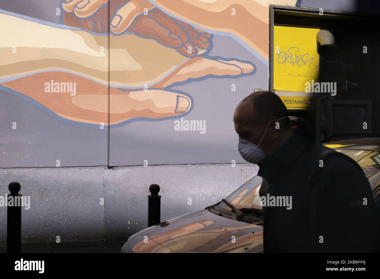 In the historic city centre in Naples, Italy, a man wearing a ...