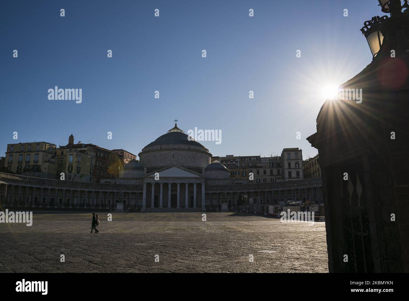 A few people walking in Piazza del Plebiscito, the Neapolitan landmark ...