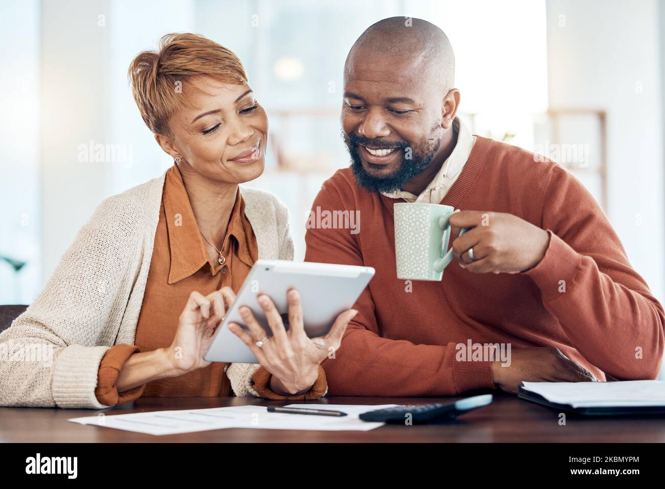 Finance, tablet and black couple doing online banking in home to check ...