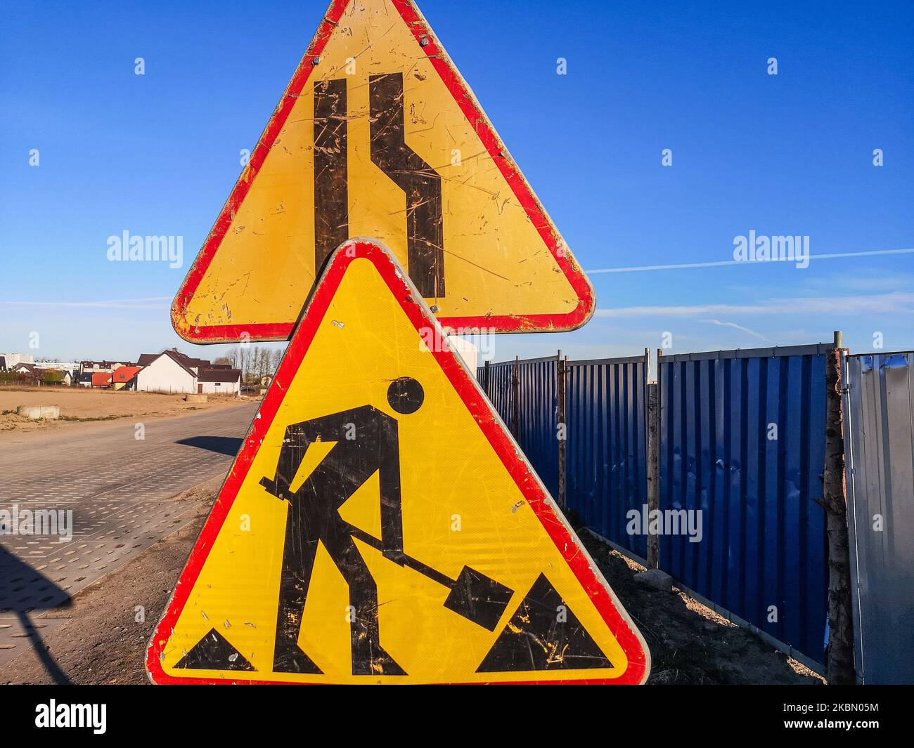 Men at work road sign on a repaired road section is seen in Gdansk ...